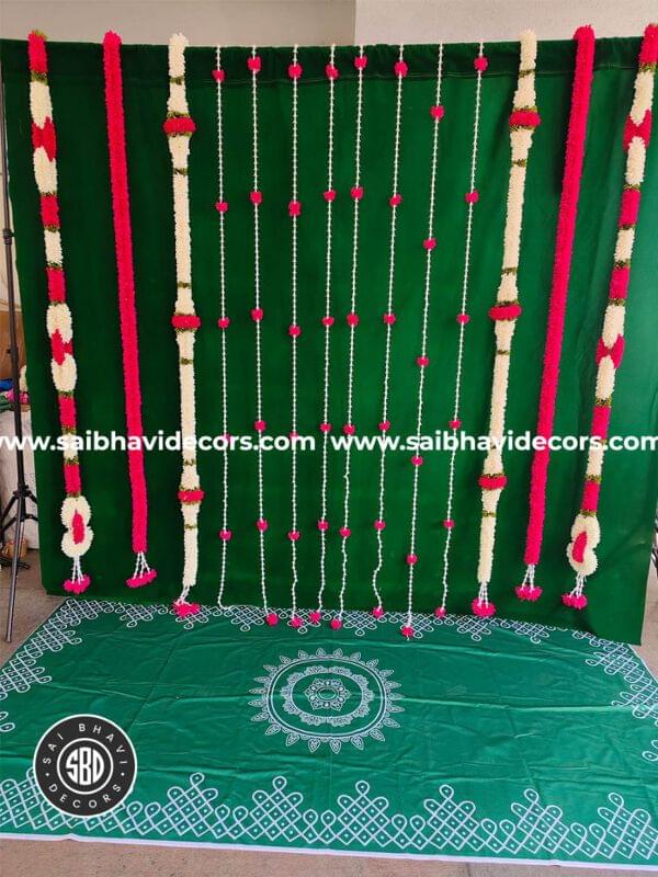 White and Pink strings with Green Velvet Backdrop Set | Sai Bhavi Decors