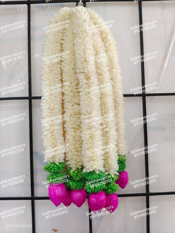 white strings light green zinia flowers and lotisbuds | Sai Bhavi Decors